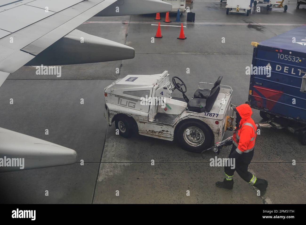 Workers attend a Delta Air Lines flight at Hartsfield-Jackson Atlanta ...