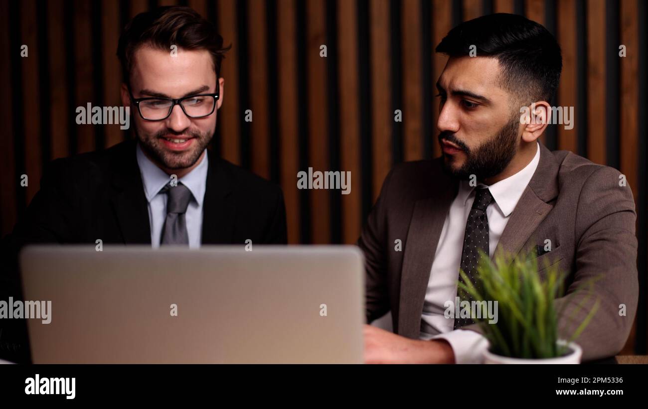 Business man having a discussion with his colleague in an office Stock ...