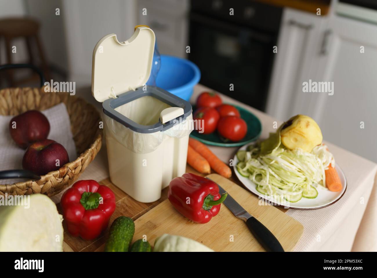 Compost bin on a kitchen table. Specializer bokashi container with ...
