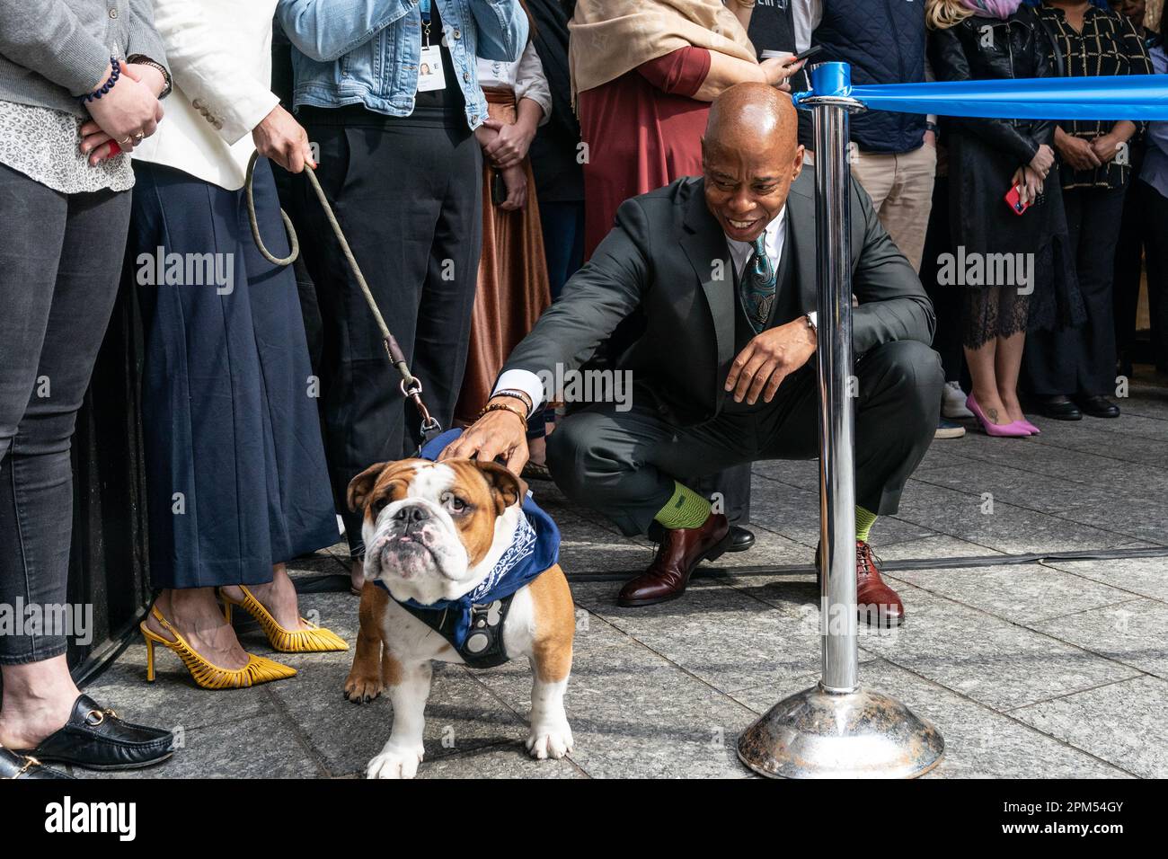 Mayor Eric Adams showing his love for dogs while attending Grand ...