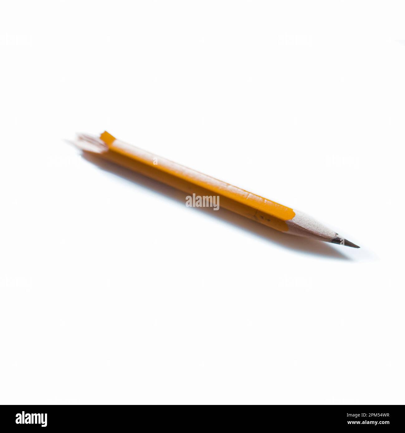 Broken pencil on white background Stock Photo - Alamy