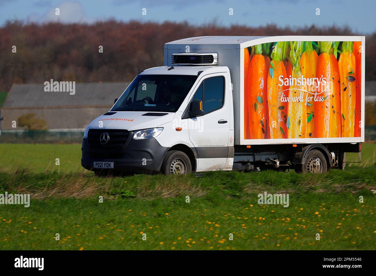 Sainsbury's delivery vehicle delivering groceries to residents in ...
