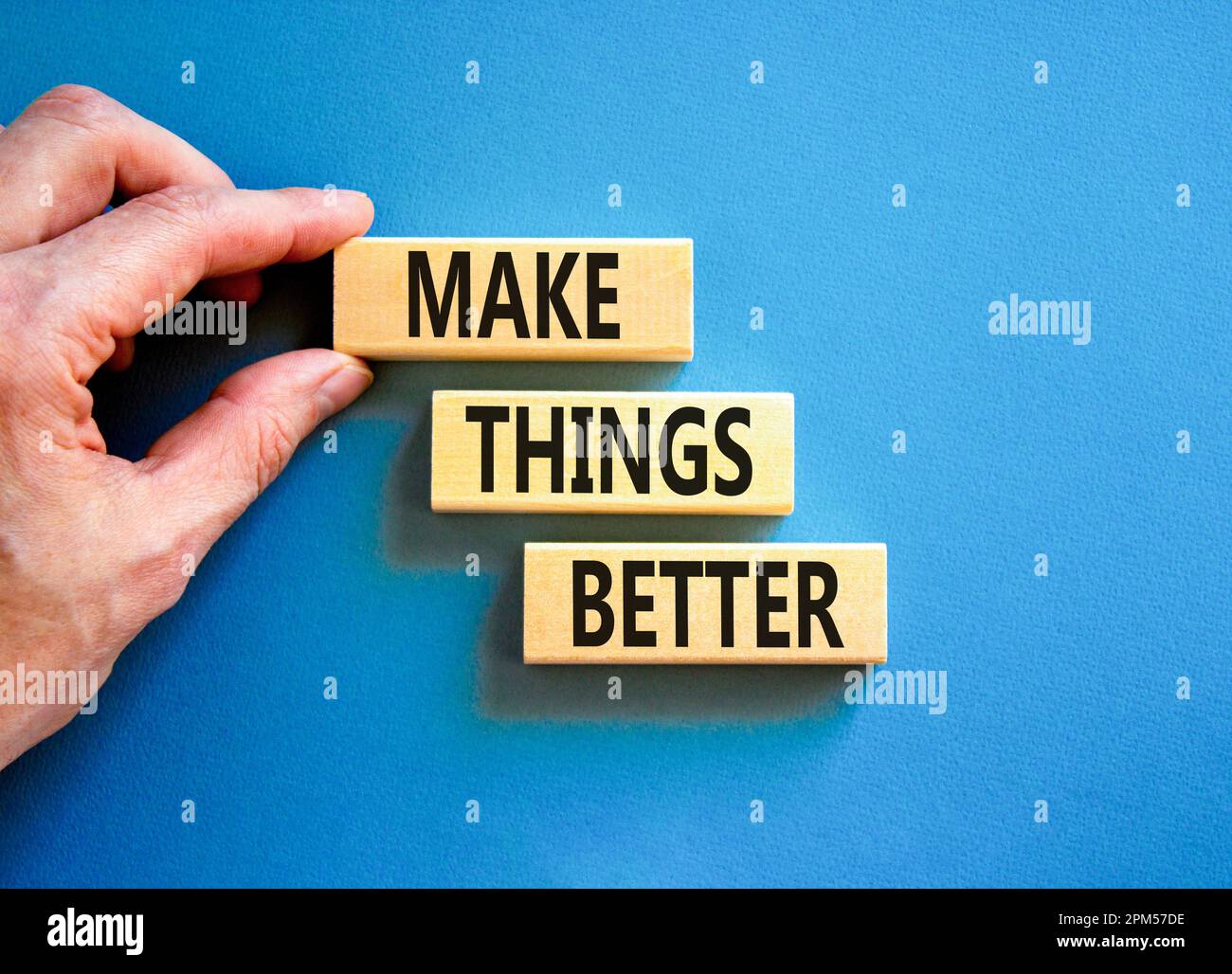 Make things better symbol. Concept words Make things better on wooden ...
