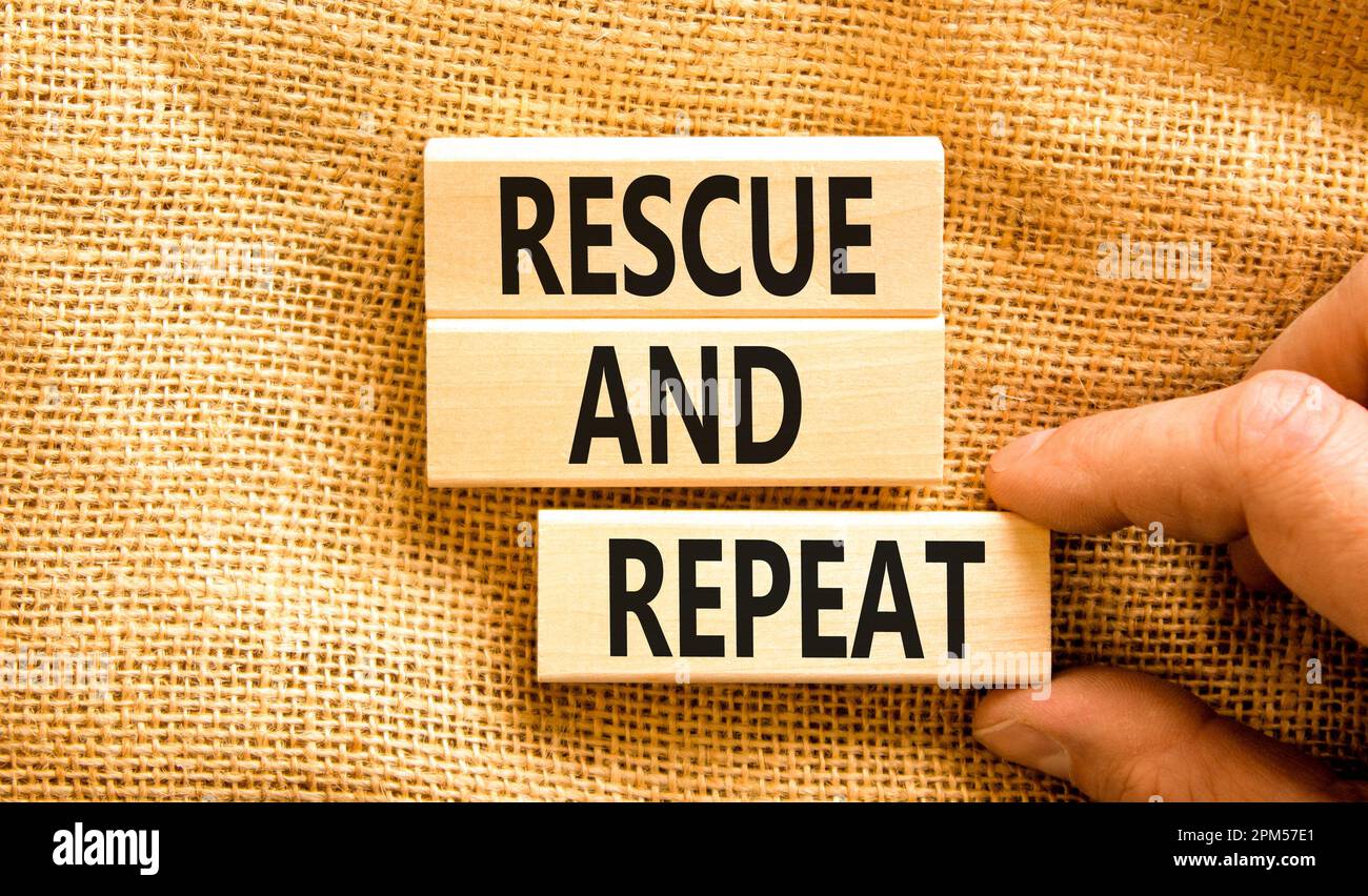 Rescue and repeat symbol. Concept words Rescue and repeat on wooden block on a beautiful canvas ...
