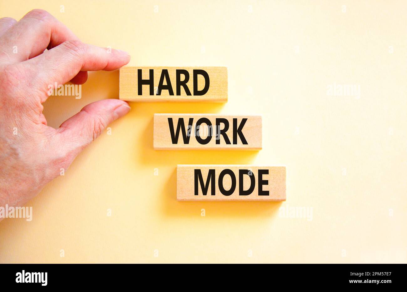 Hard work mode symbol. Concept words Hard work mode on wooden block on ...