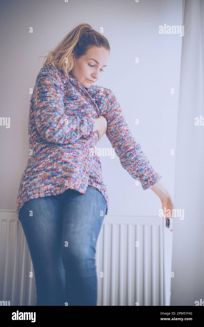 Cold, depressed mid-aged woman at home feeling sad, lonely, anxious ...