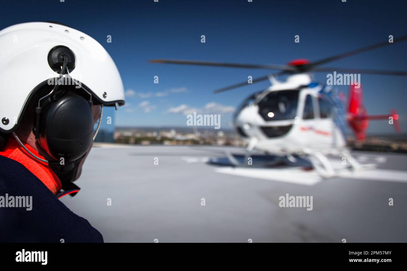 Modern medical helicopter on a hospital rooftop helipad Stock Photo - Alamy