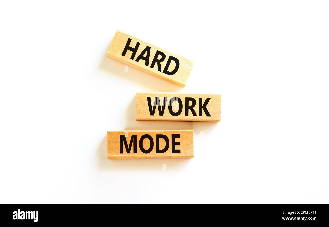 Hard work mode symbol. Concept words Hard work mode on wooden block on ...