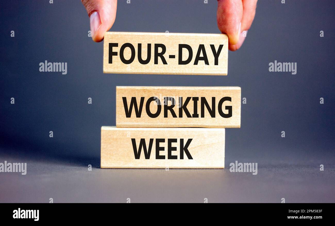 Four-day working week symbol. Concept words Four-day working week on wooden block on a beautiful ...