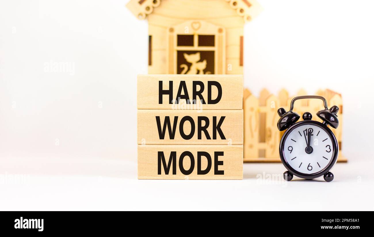 Hard work mode symbol. Concept words Hard work mode on wooden block on ...