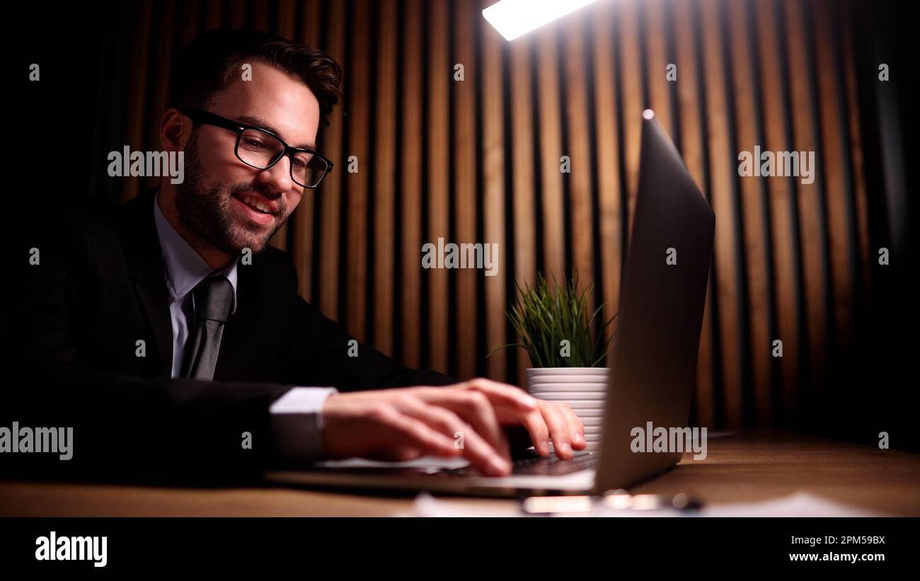 successful employee stretching and yawning during break in office after ...