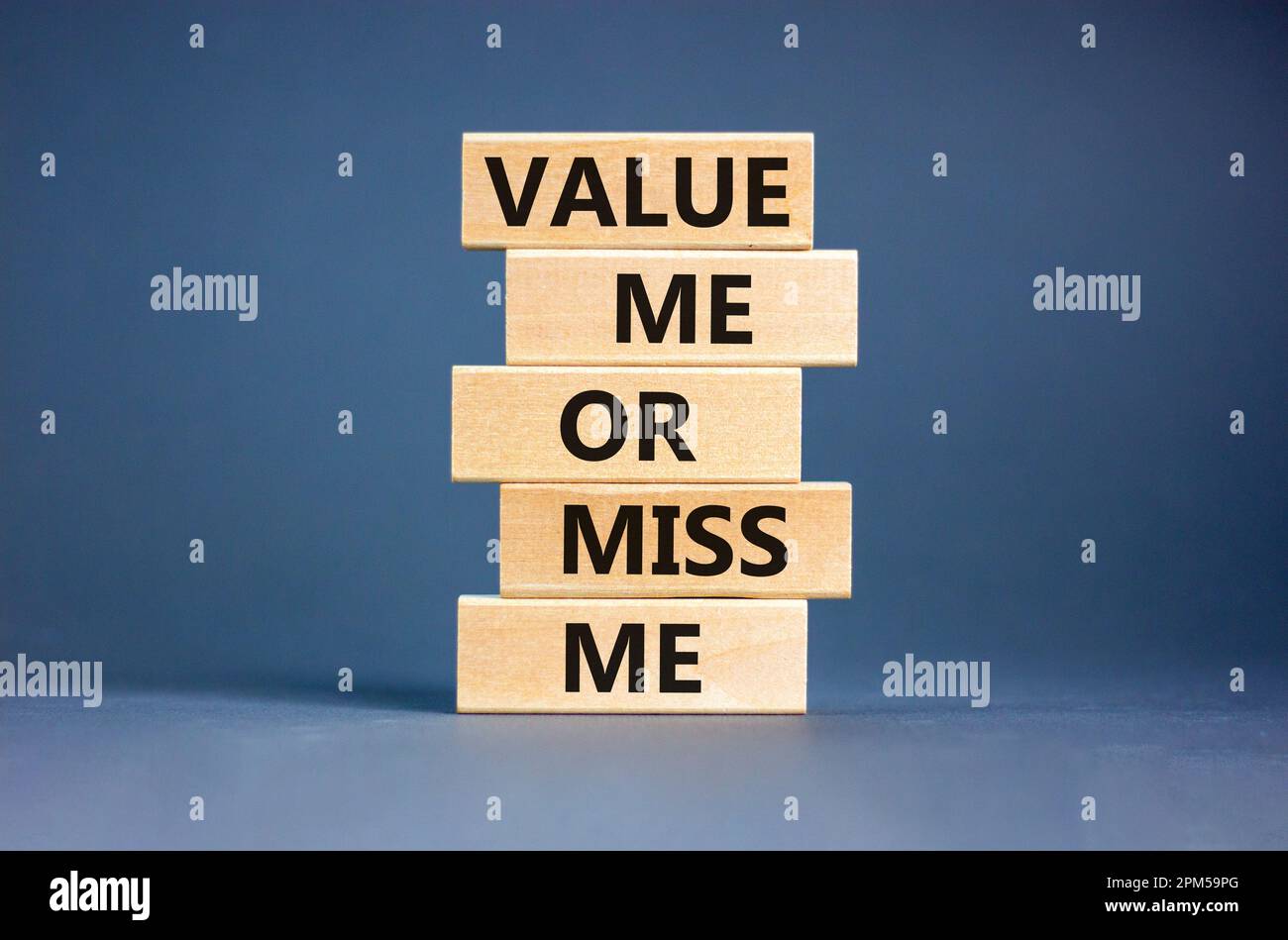 Value or miss me symbol. Concept words Value me or miss me on wooden ...