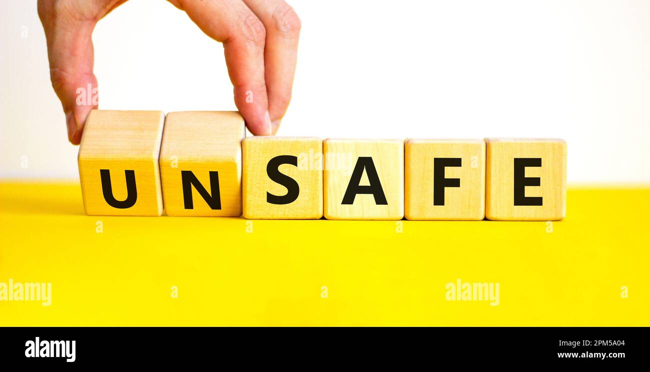 Safe or unsafe symbol. Concept word Safe Unsafe on wooden cubes ...