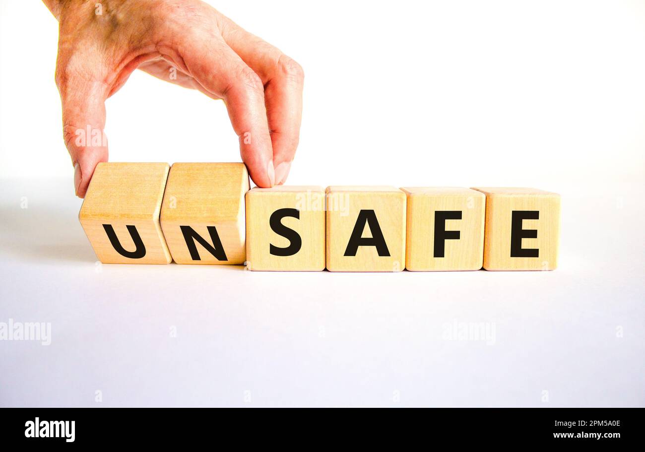 Safe or unsafe symbol. Concept word Safe Unsafe on wooden cubes ...