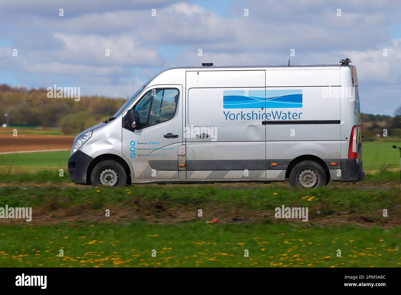 Yorkshire Water company vehicle travelling along a rural road in North Yorkshire Stock Photo - Alamy