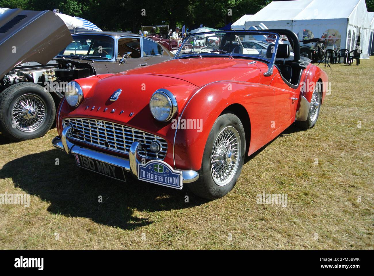 A 1957 Triumph TR3 convertible sports car parked on display at the 47th ...