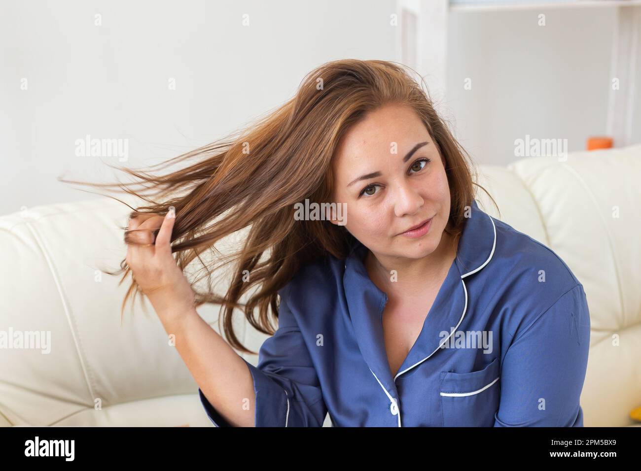Glamorous woman wears pajama with happy smile chilling in good morning ...