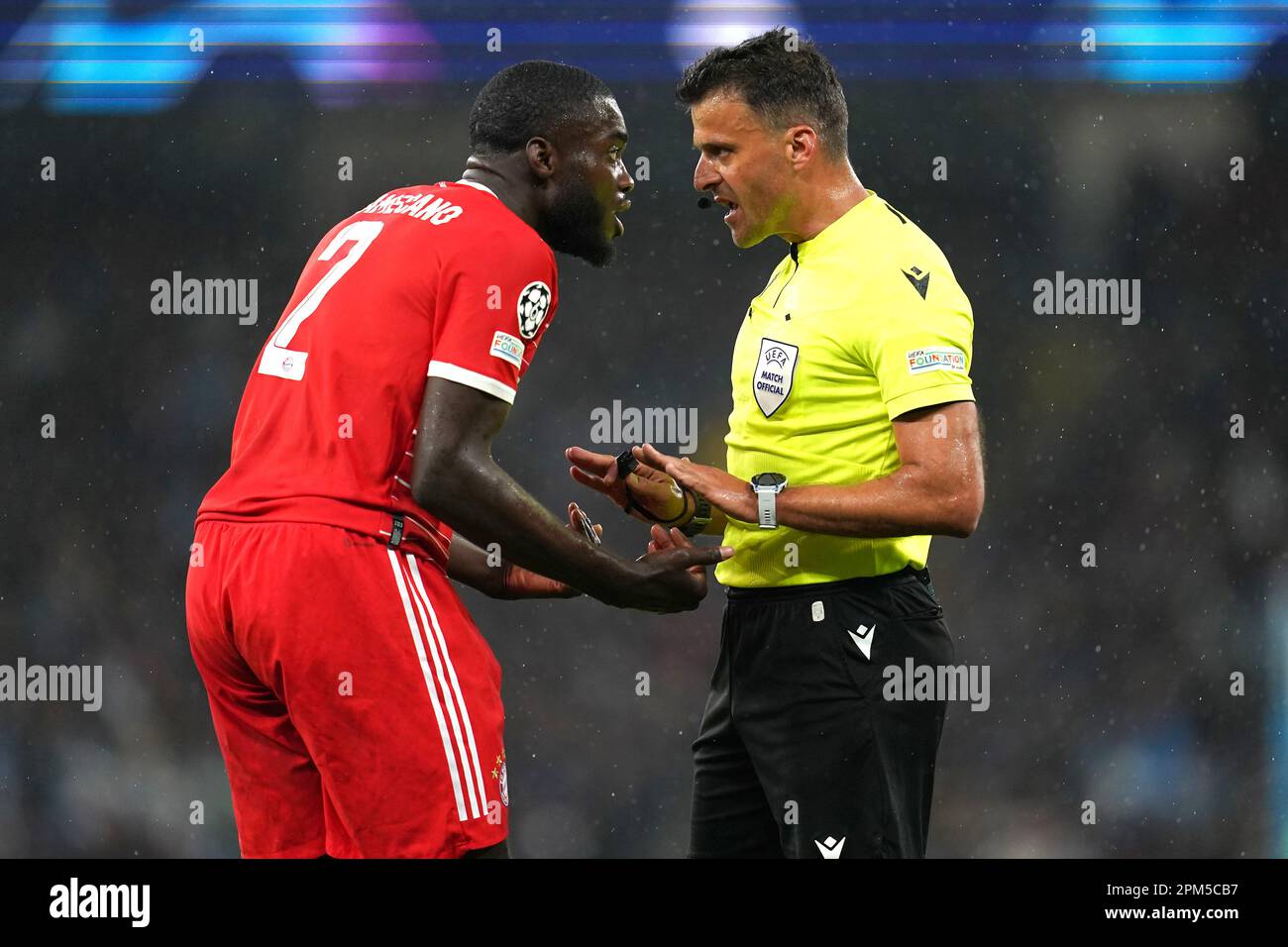 Bayern Munich's Dayot Upamecano (left) speaks with referee Jesus Gil ...