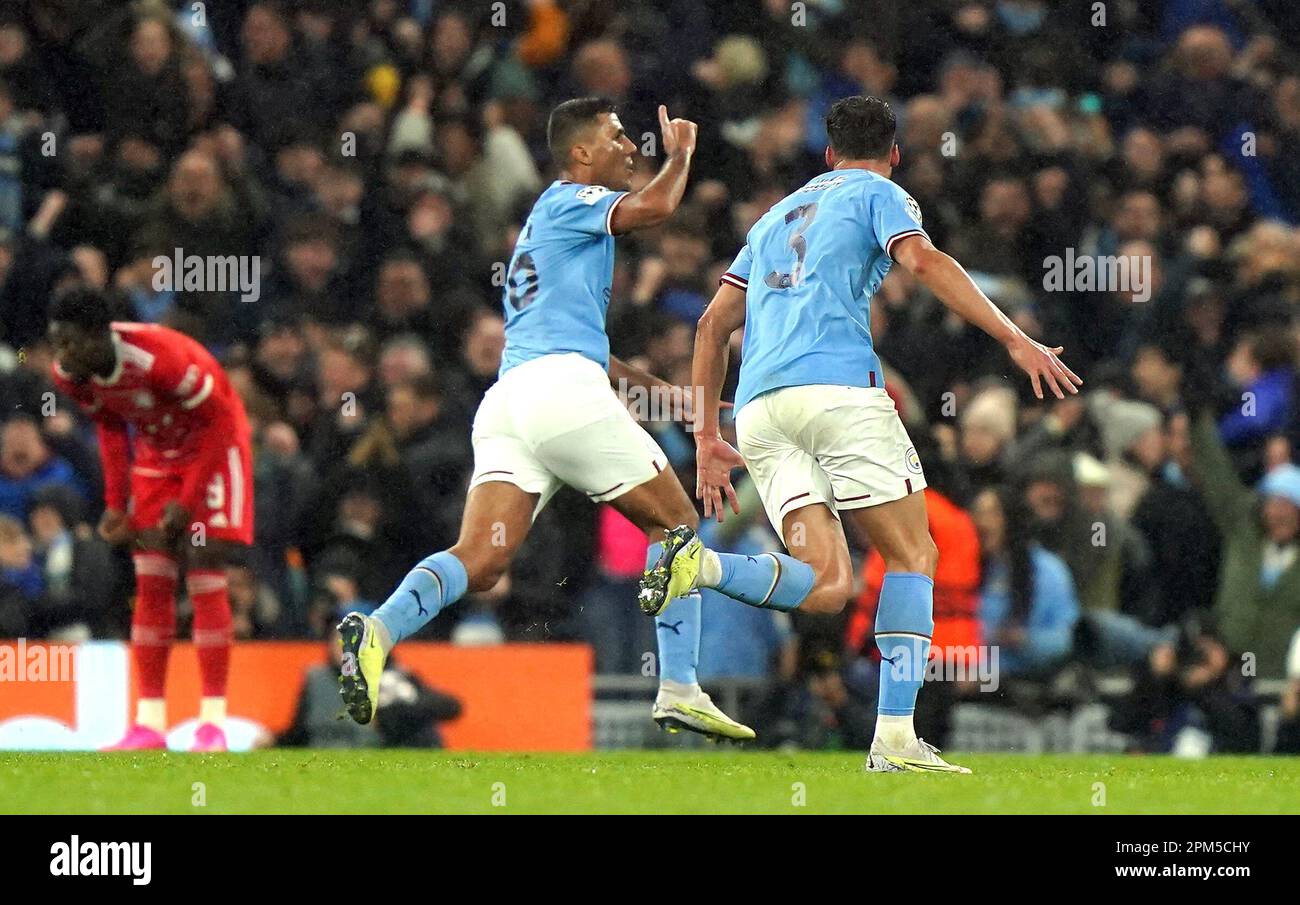 Manchester City's Rodri (left) celebrates scoring their side's first ...