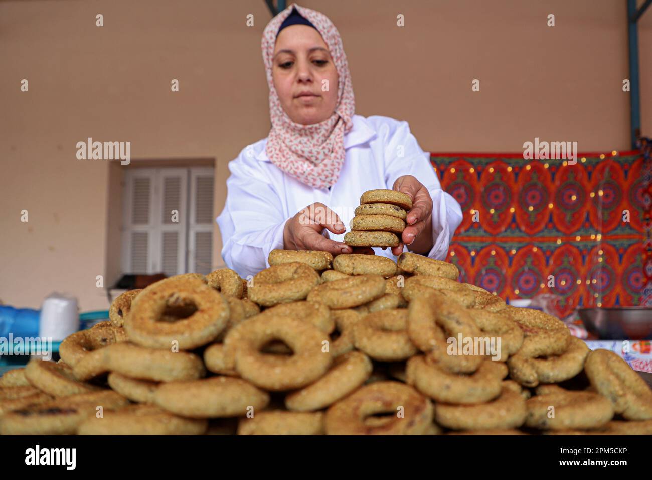 Gaza. 11th Apr, 2023. A Palestinian woman makes traditional cookies for ...