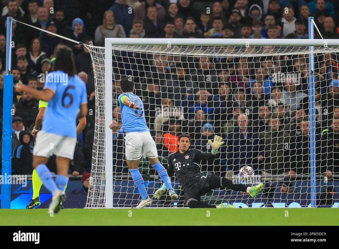 Yann Sommer #27 of Bayern Munich saves a shot from İlkay Gündoğan #8 of Manchester City during ...