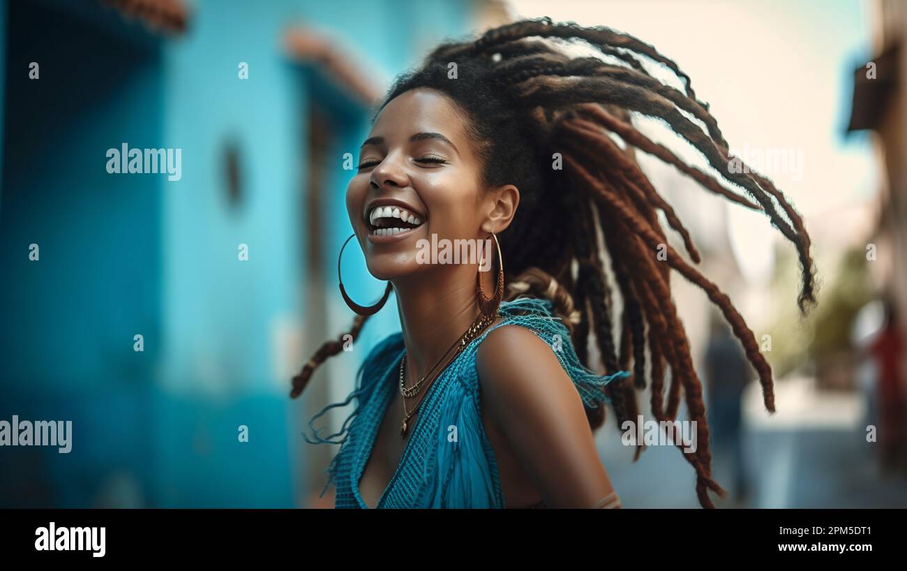 Happy young afro woman dancing on the street of a small town Stock ...