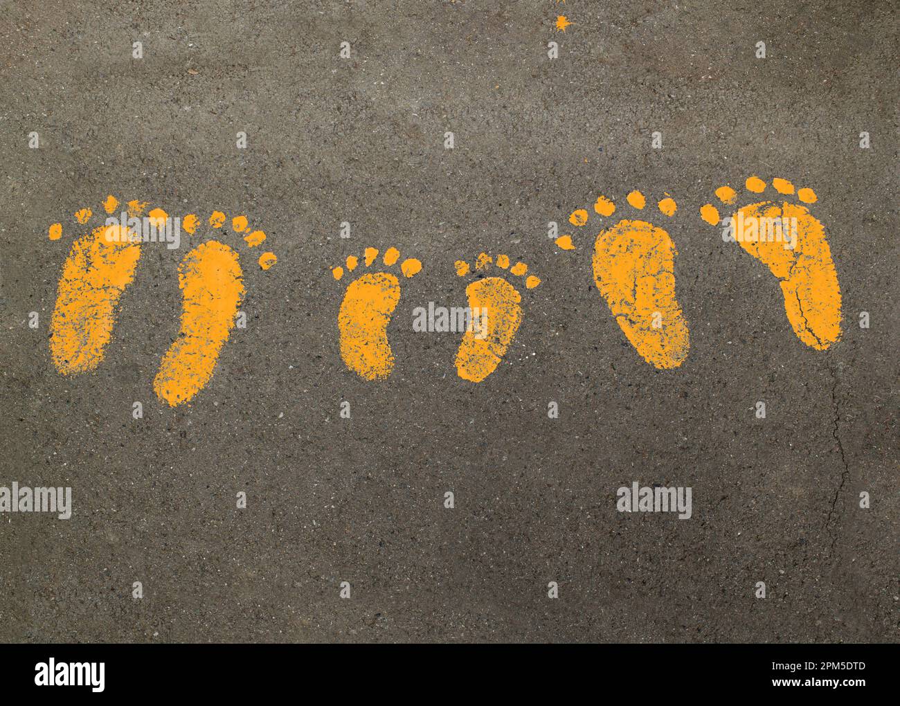 Painted footprints on the asphalt Stock Photo - Alamy