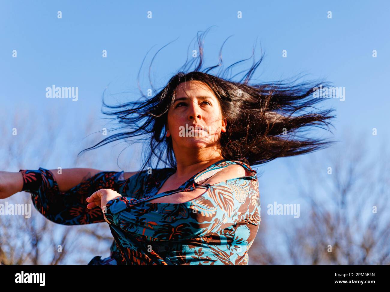Close-up of woman spinning with hair flying in all directions Stock ...