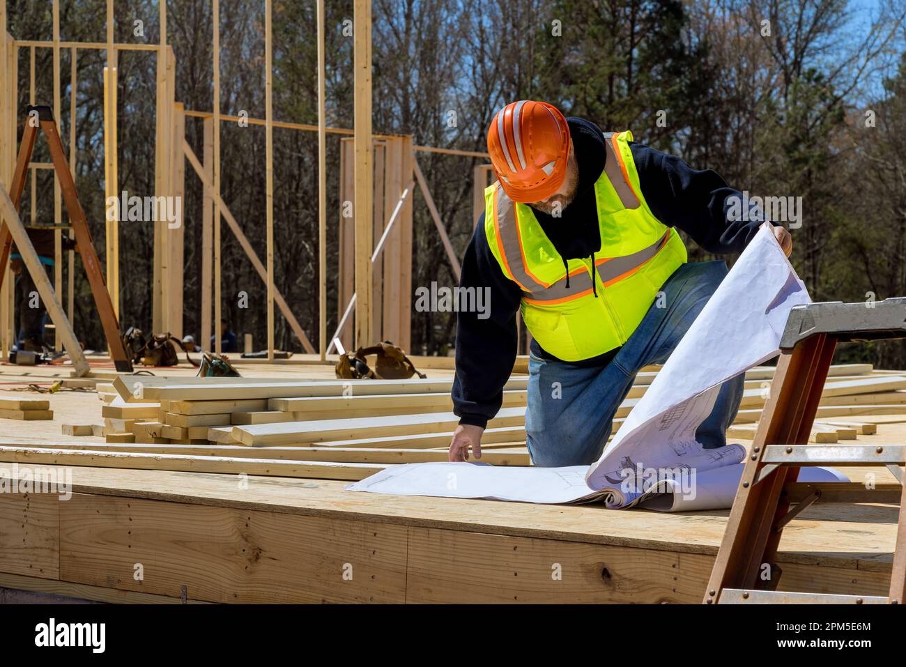 Architect checks building blueprints on hi-res stock photography and ...