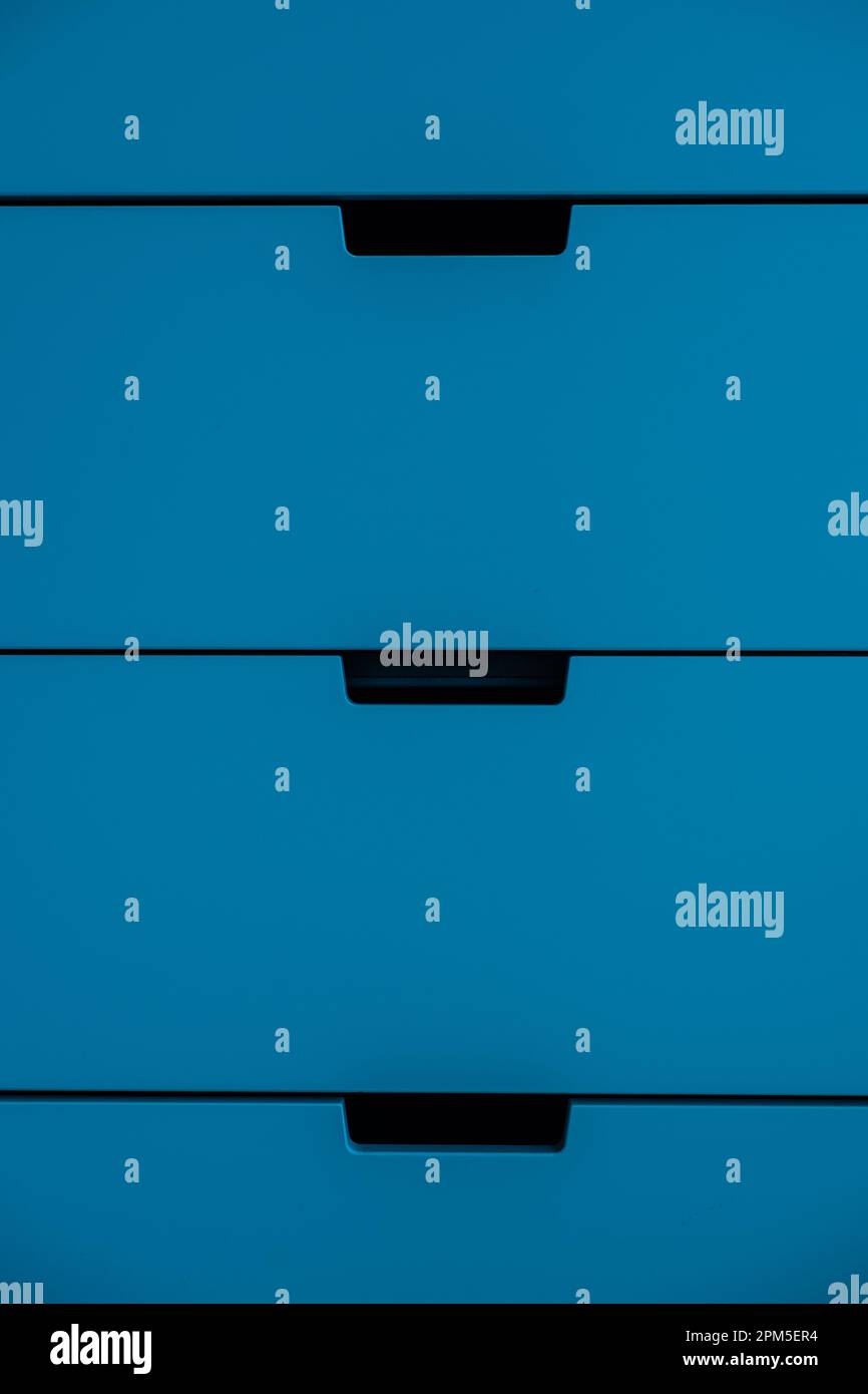 Handles of a blue drawers Stock Photo - Alamy