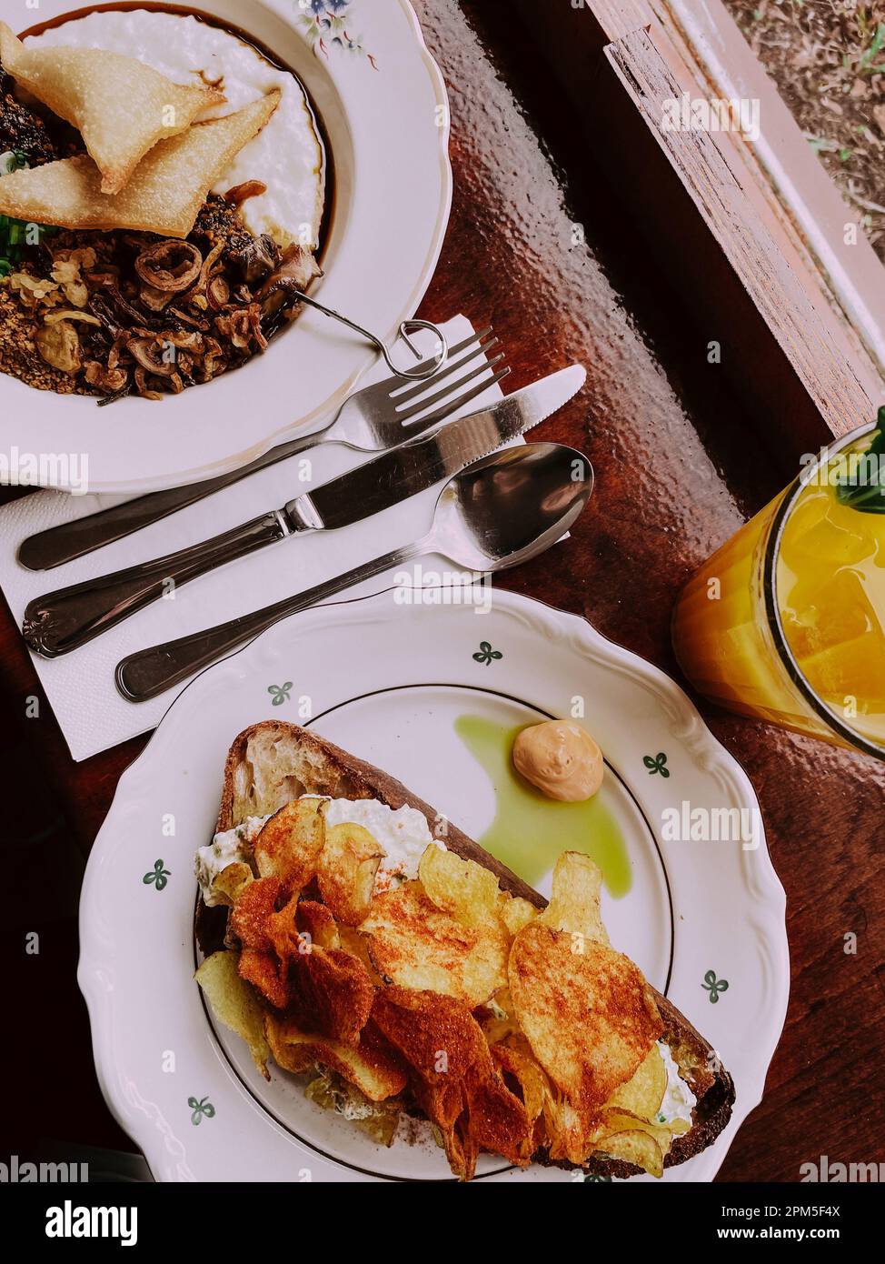 Fancy brunch dishes with lemonade and cutlery on the table, top view ...