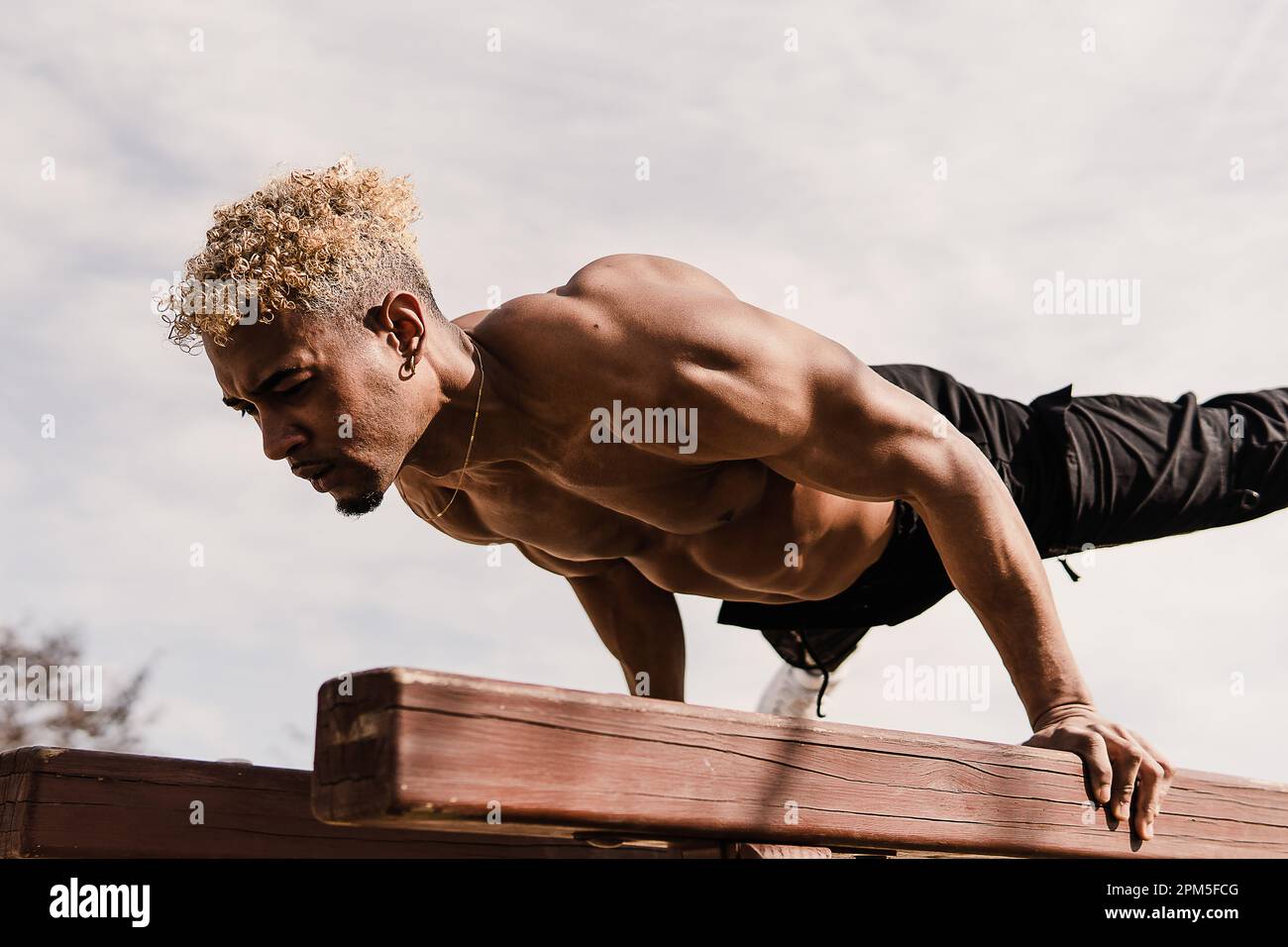 Stock photo of black man doing calisthenics in a park Stock Photo - Alamy Stock photo of black man doing calisthenics in a park Stock Photo - Alamy