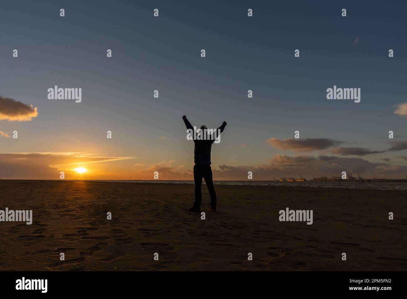 Silhouette man raising arms hi-res stock photography and images - Alamy