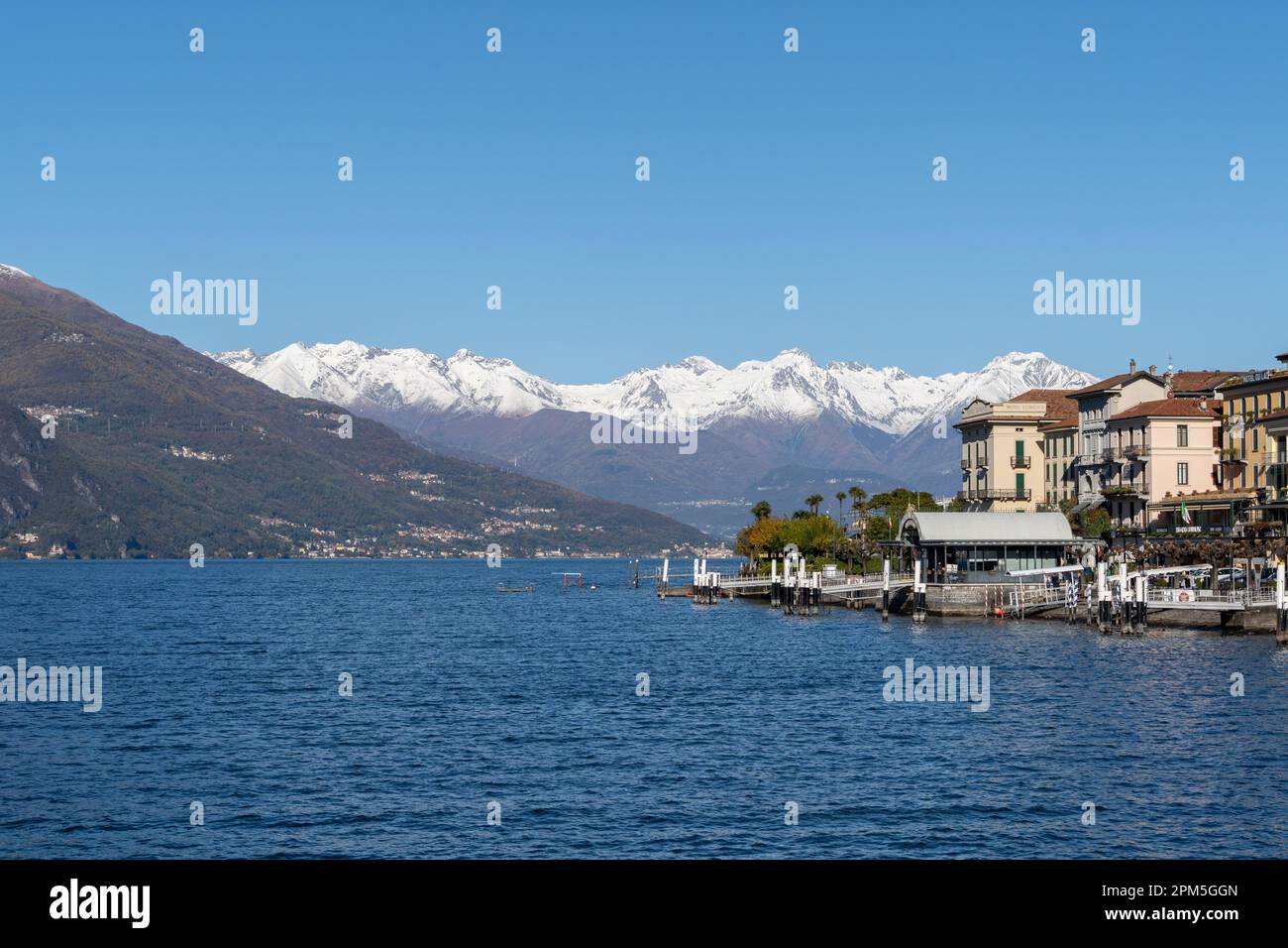 scenic view of the port of menaggio with the snowy mountains Stock ...