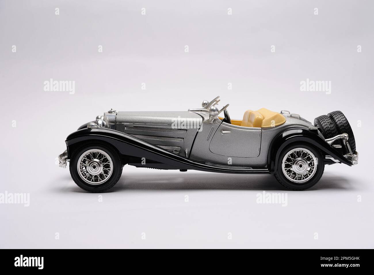 1930's Model of a vintage car on a white background with space for text ...