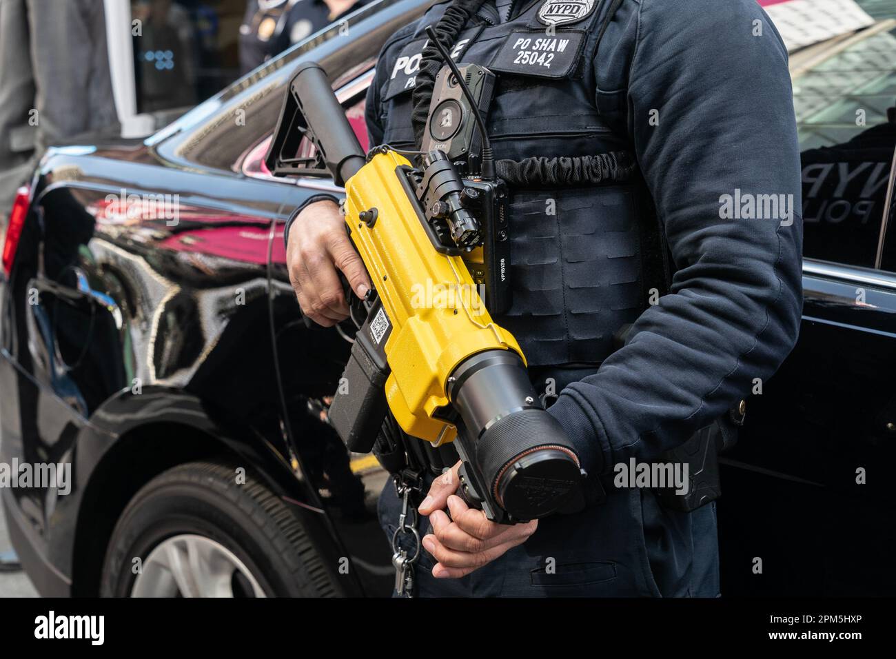 Police officer displays StarChase hand-held launcher during NYPD ...