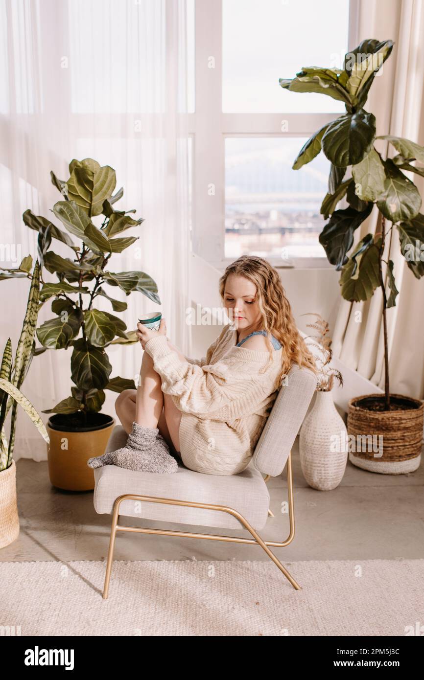 Woman in cozy oversized sweater hi-res stock photography and images - Alamy