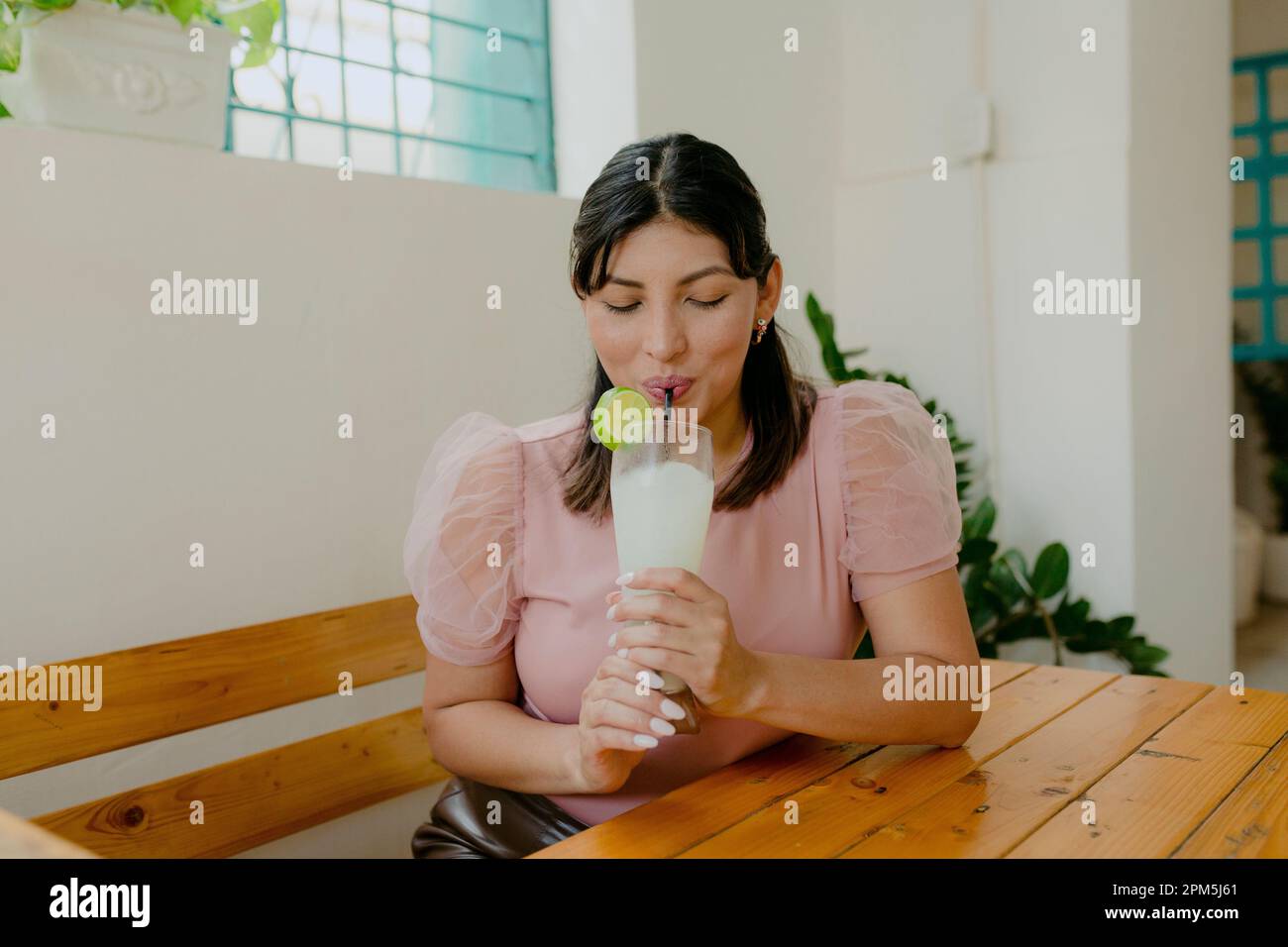 Girl drinking lemonade hi-res stock photography and images - Alamy