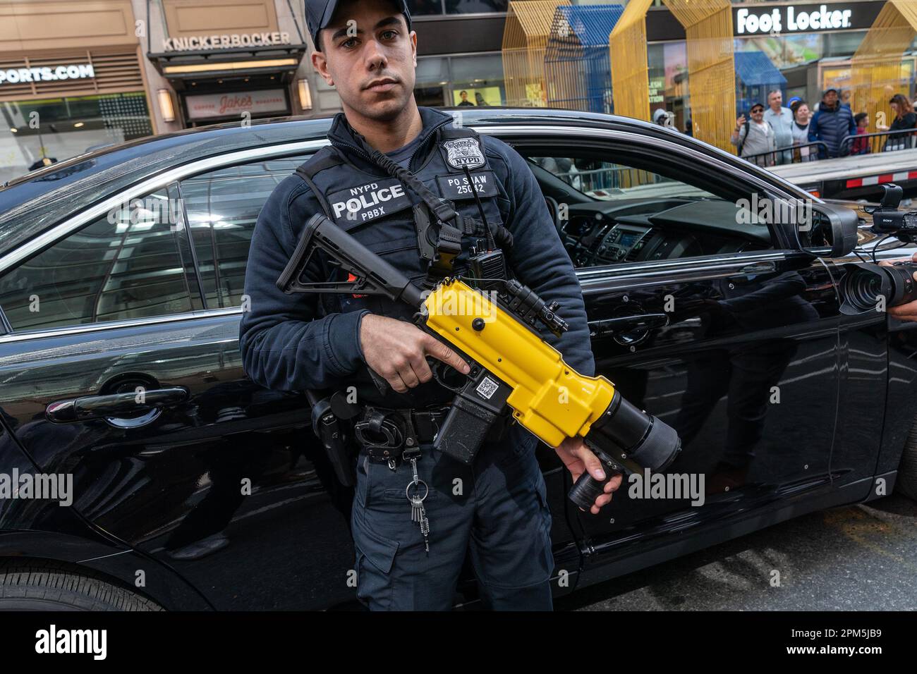 New York, USA. 11th Apr, 2023. Police officer displays StarChase hand ...