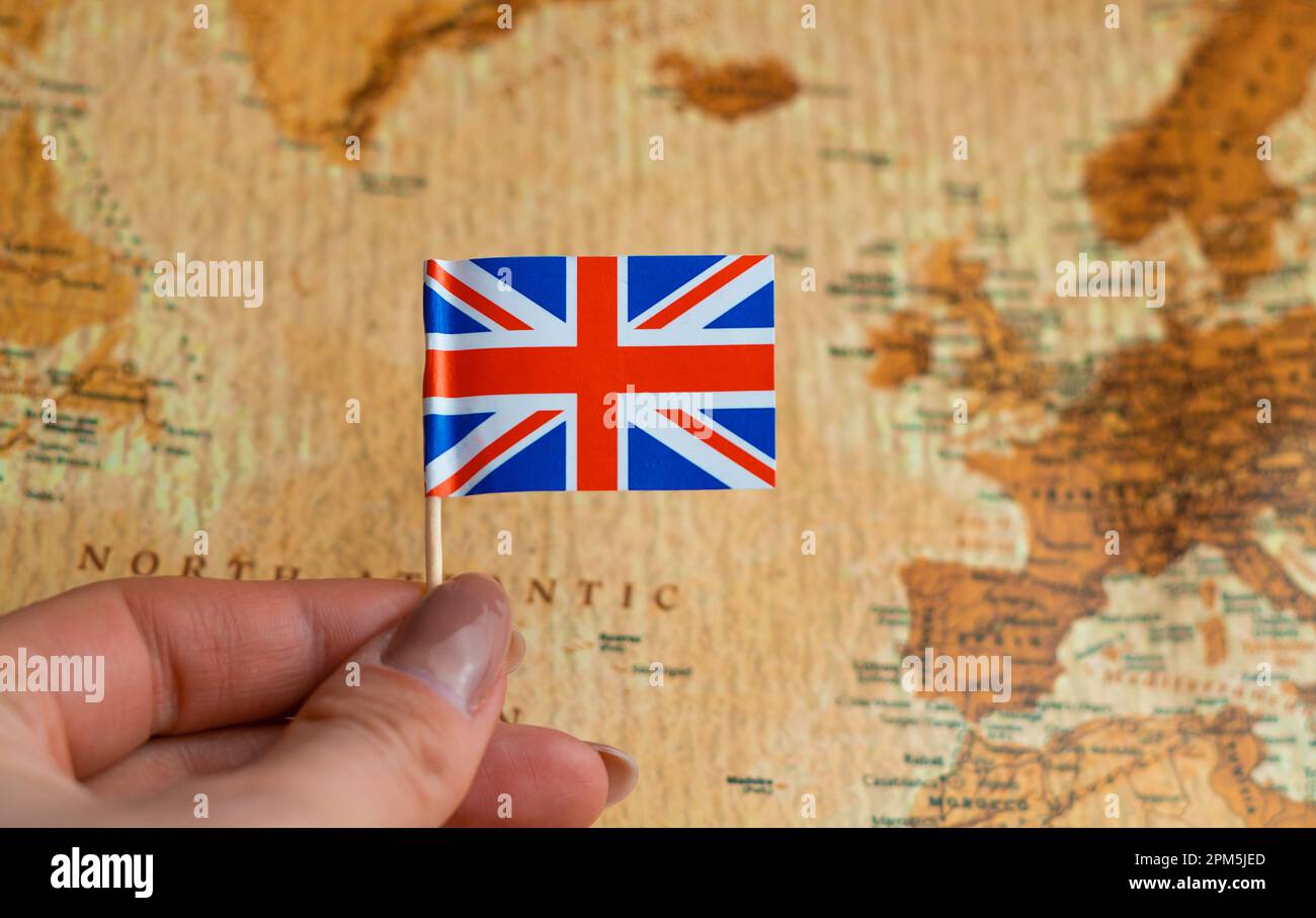 the national union jack flag of great britian ,blue and red on world ...