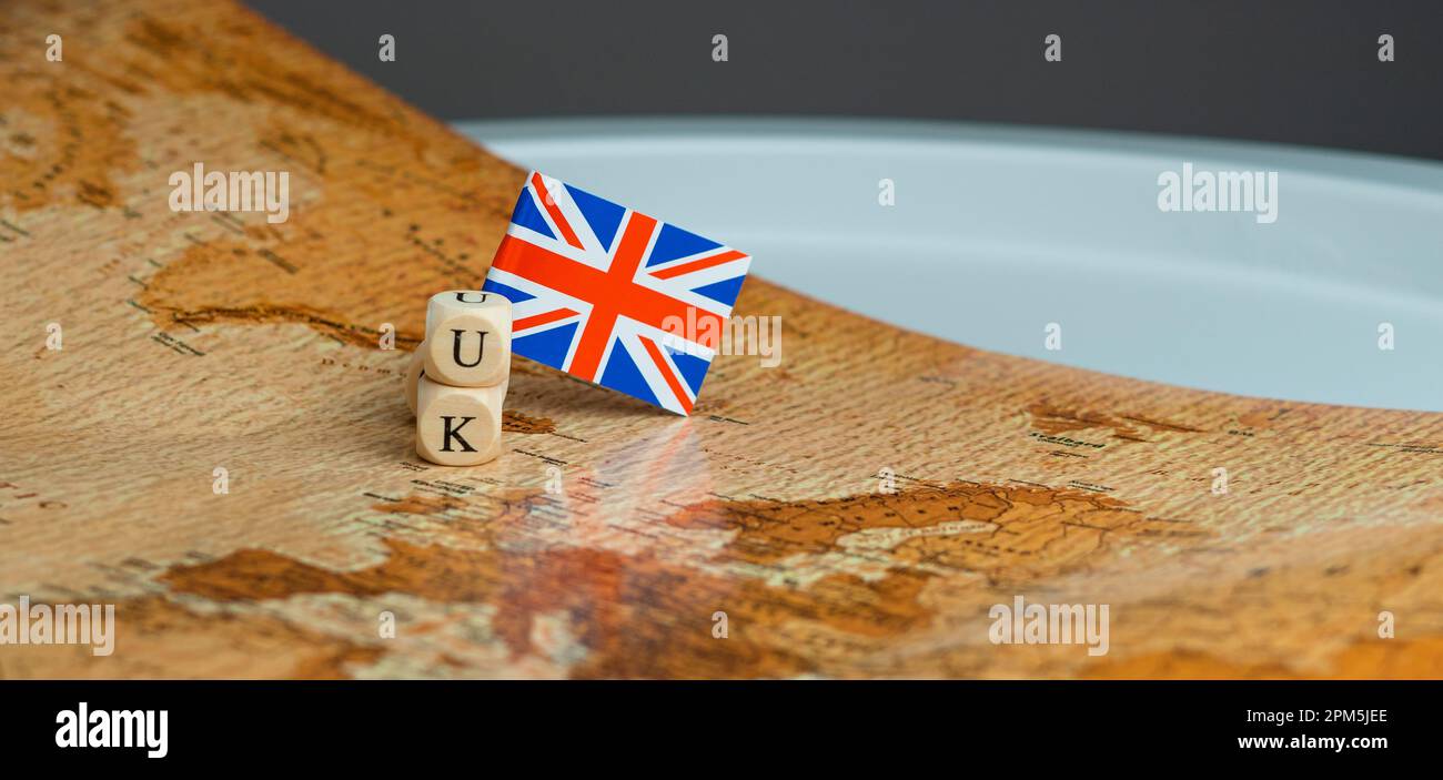 the national union jack flag of great britian ,blue and red on world ...