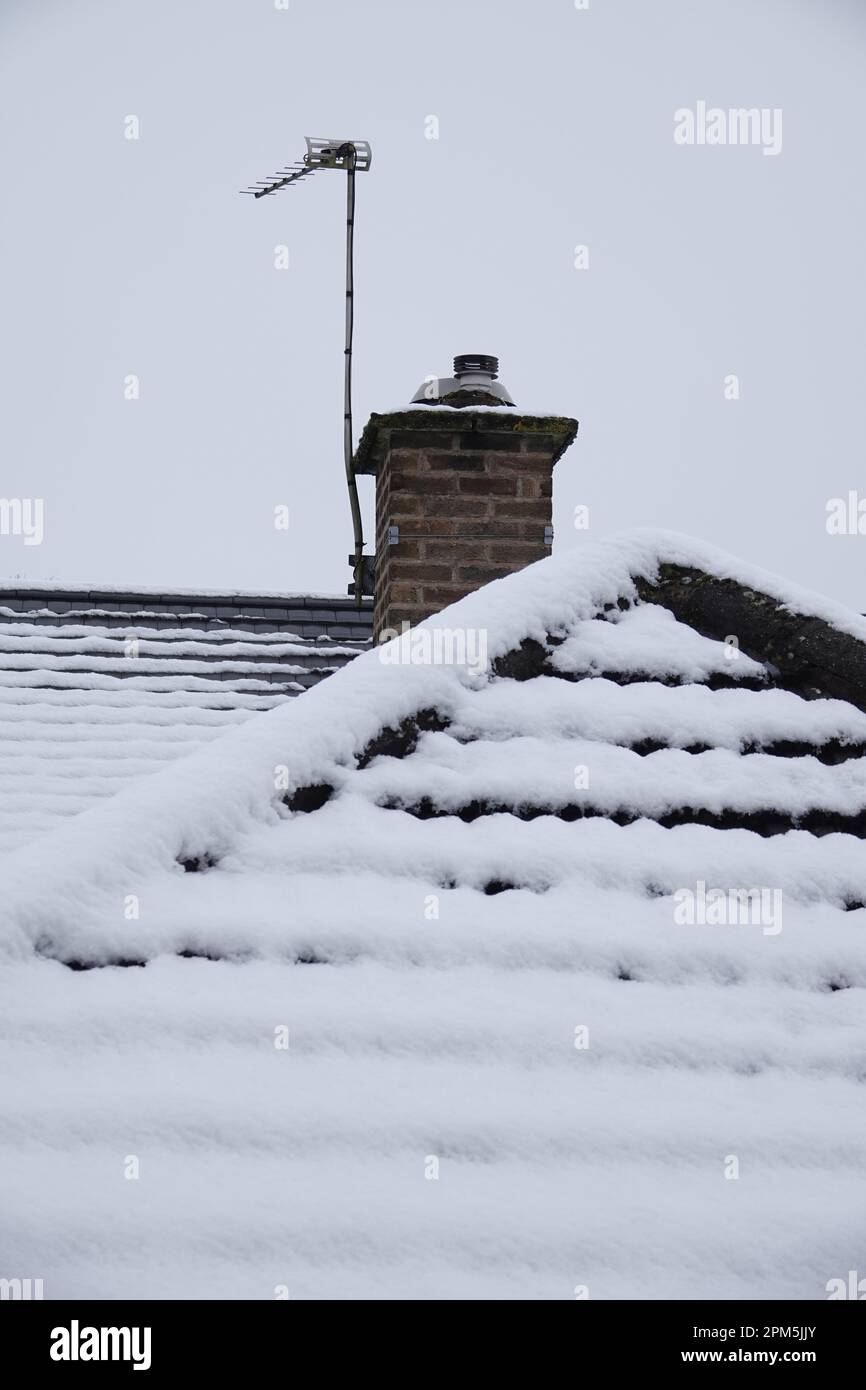 A snowy rooftop and chimney Stock Photo - Alamy
