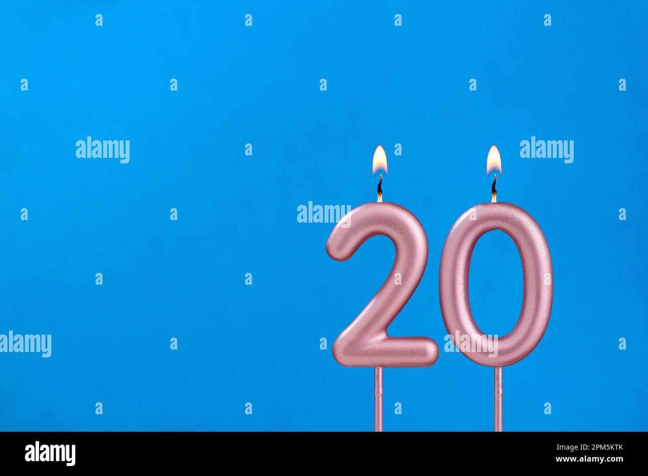 Candle number 20 - Birthday in blues foamy background Stock Photo - Alamy