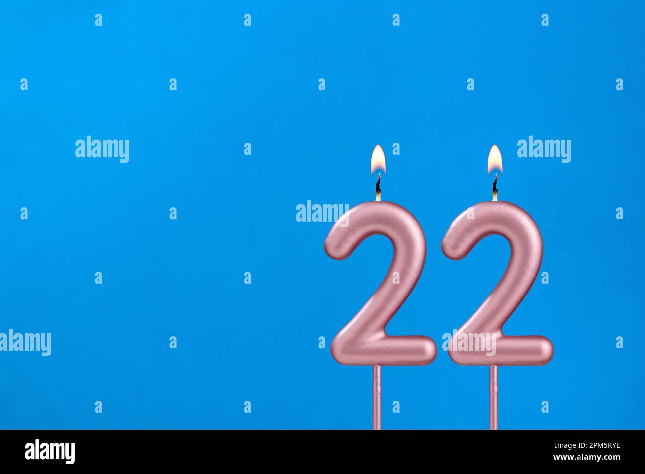 Candle number 22 - Birthday in blues foamy background Stock Photo - Alamy