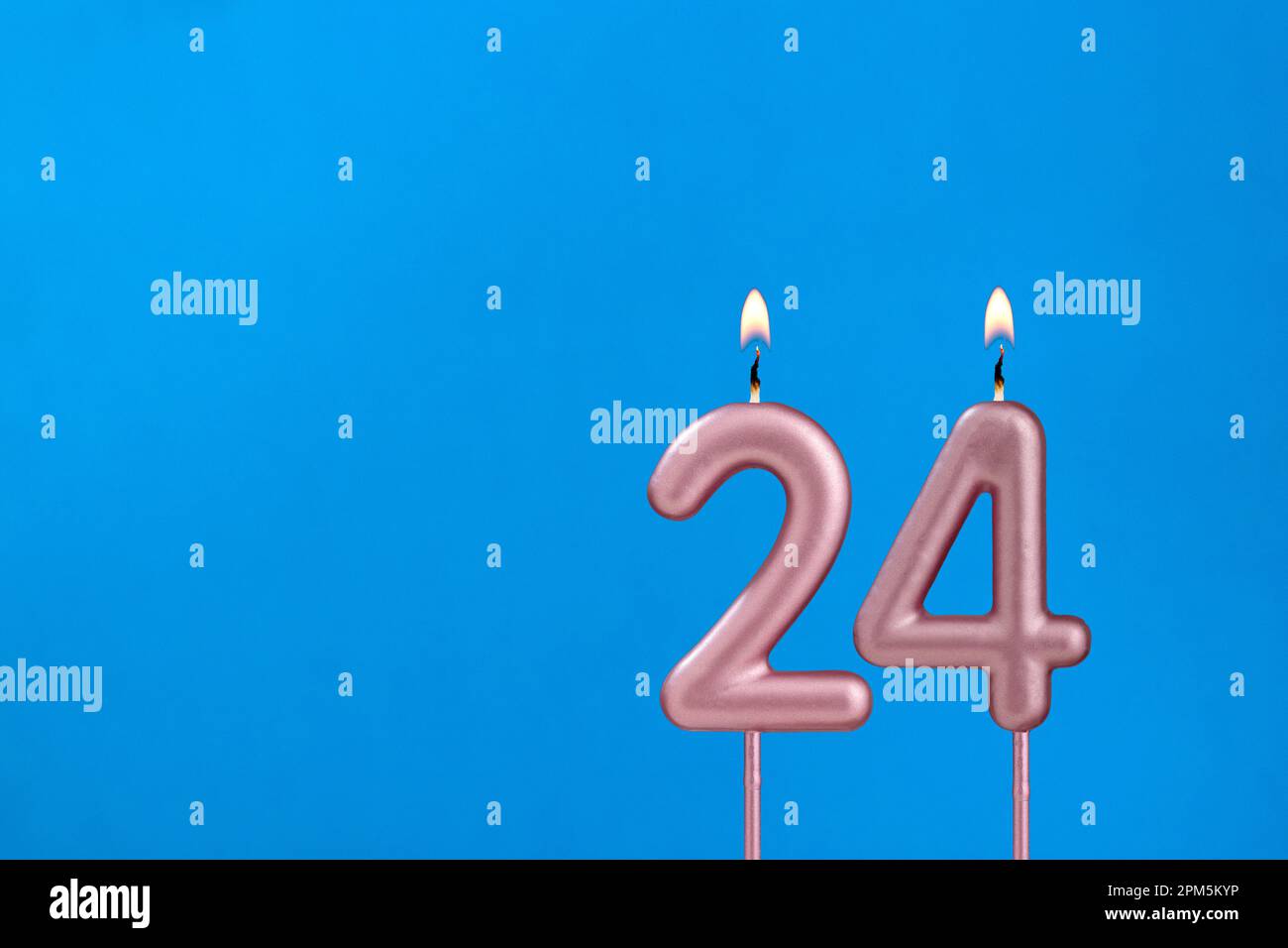 Candle number 24 - Birthday in blues foamy background Stock Photo - Alamy