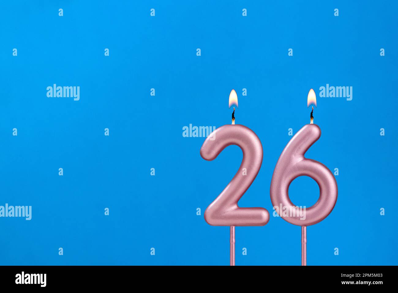Candle number 26 - Birthday in blues foamy background Stock Photo - Alamy