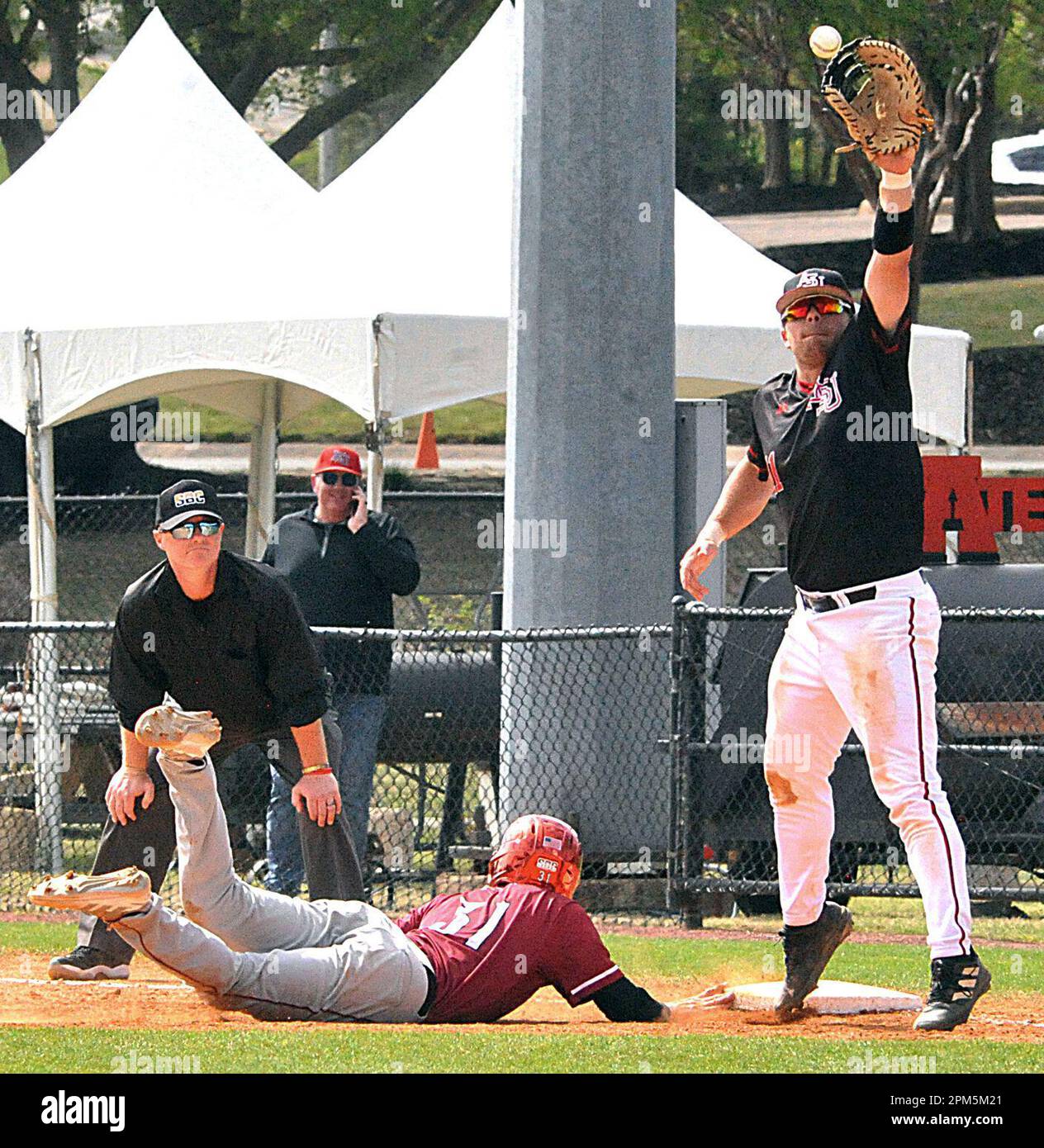 Arkansas State's Brandon Hager stretches to catch a pickoff throw as ...