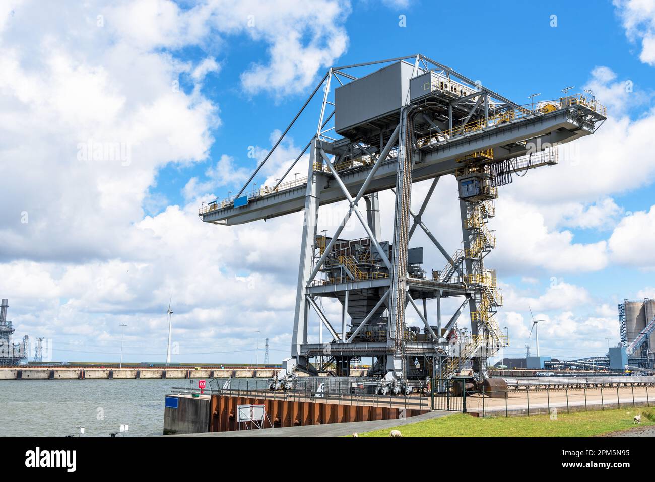 Dockside bulk-handling crane in a harbour on a sunny summer day Stock ...