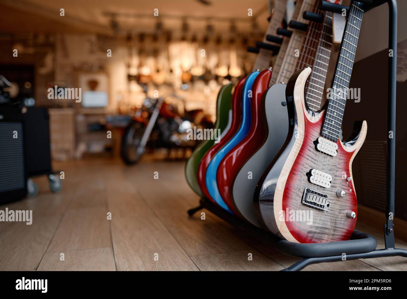 Electric guitar display at studio shop with big assortment of string ...