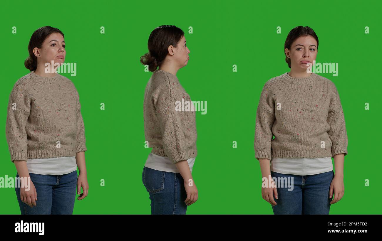 Close up of depressed model acting upset over greenscreen studio ...